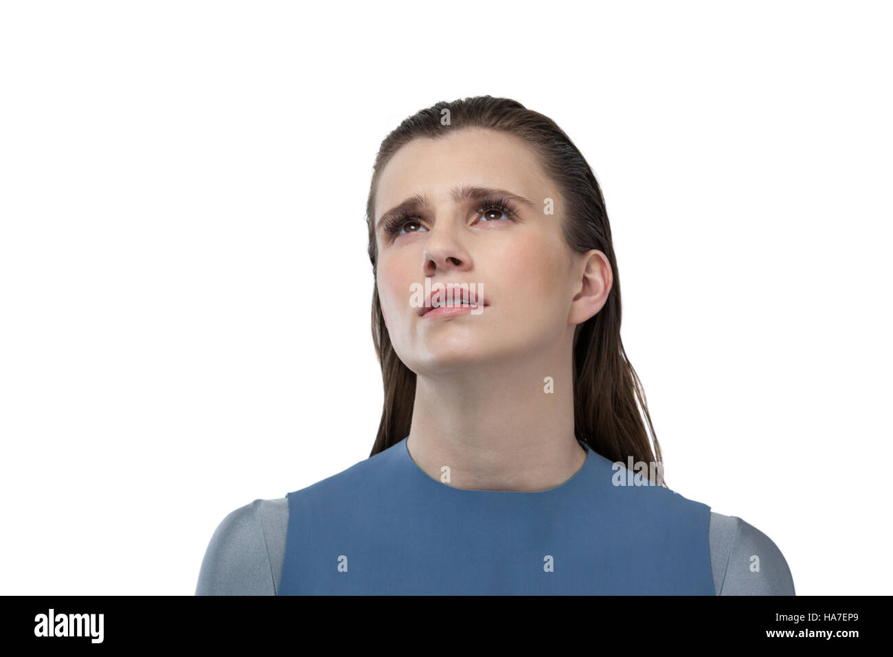 Sad woman looking up Stock Photo - Alamy