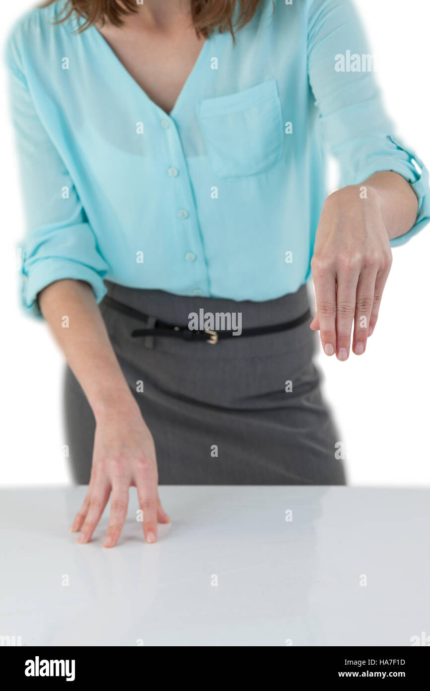 Mid section of business woman standing at table Stock Photo - Alamy