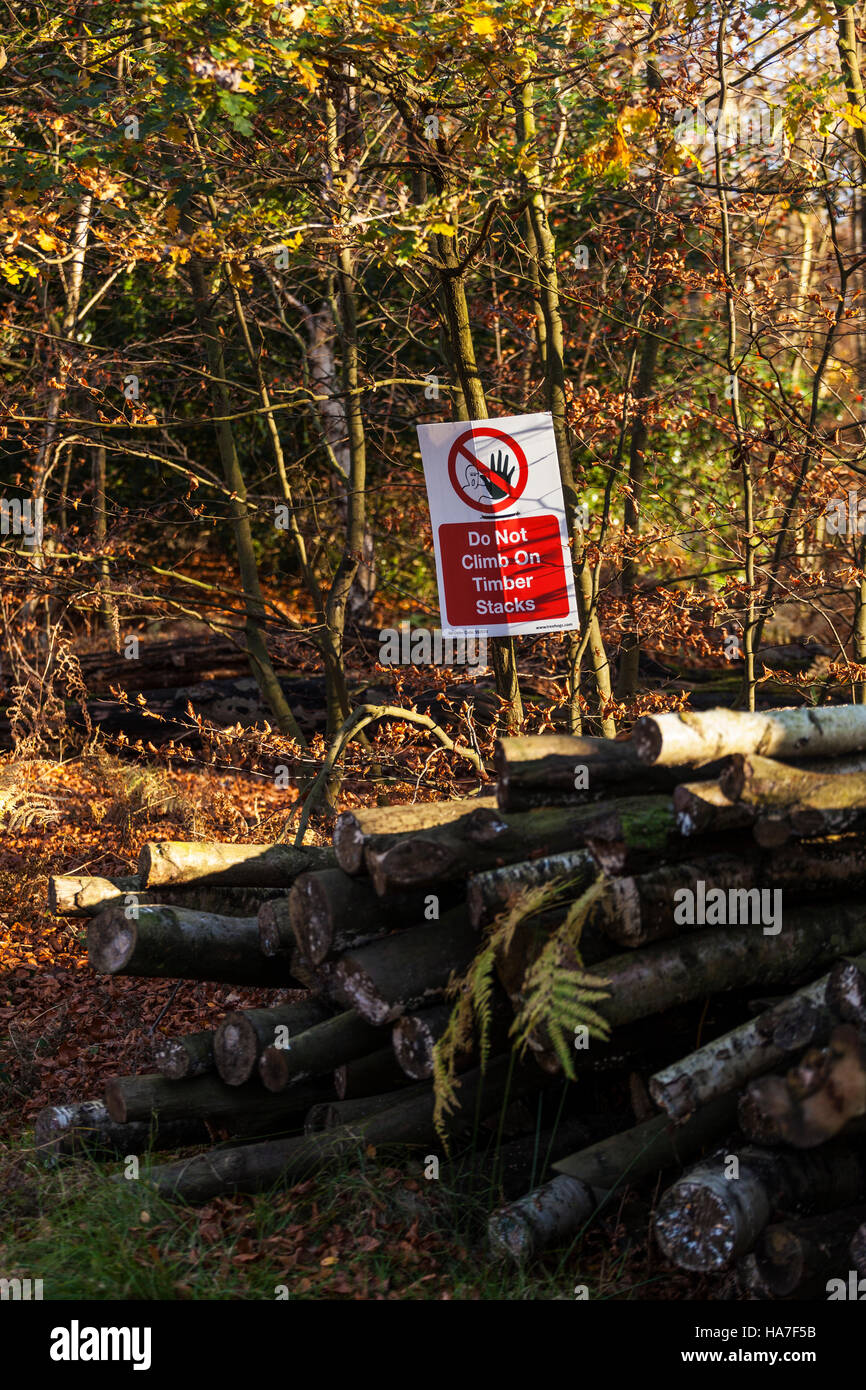 Warning Sign by Log Pile in Epping Forest Stock Photo - Alamy
