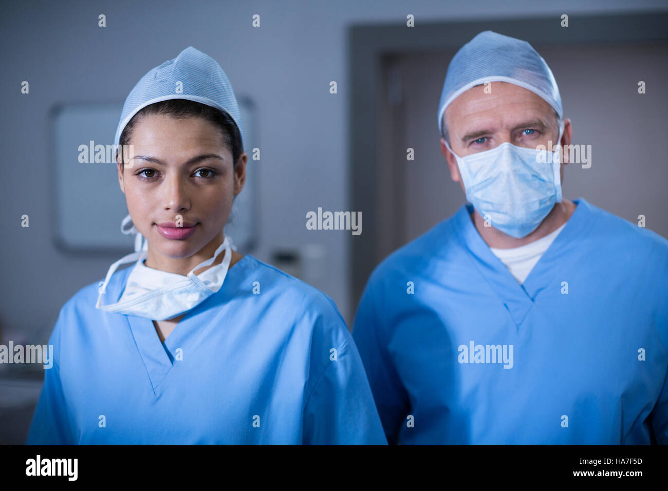 Portrait of surgeons standing in operation room Stock Photo - Alamy