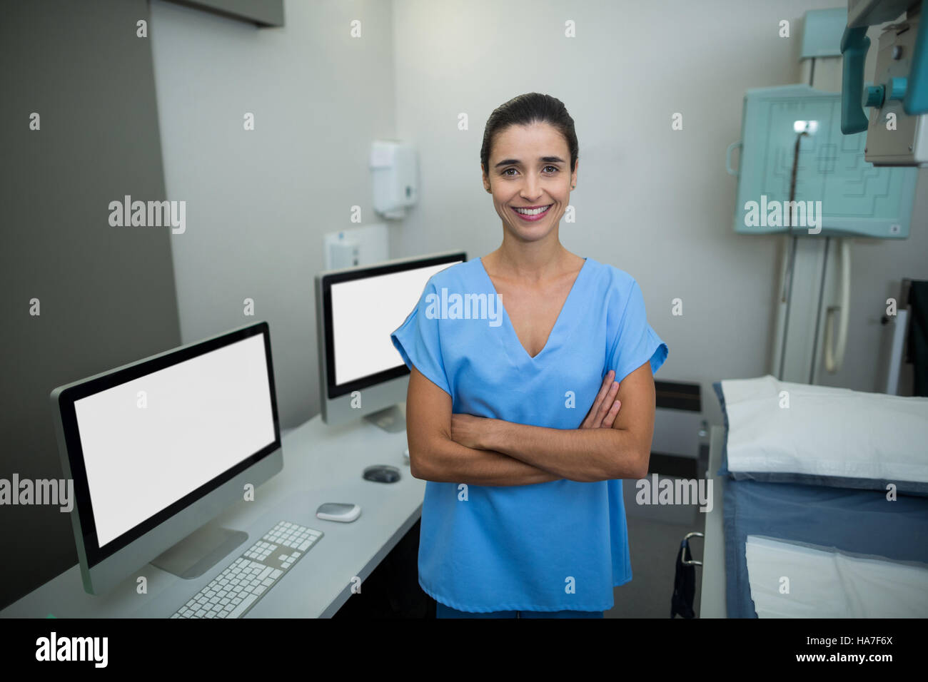 Portrait of nurse standing with arms crossed Stock Photo - Alamy