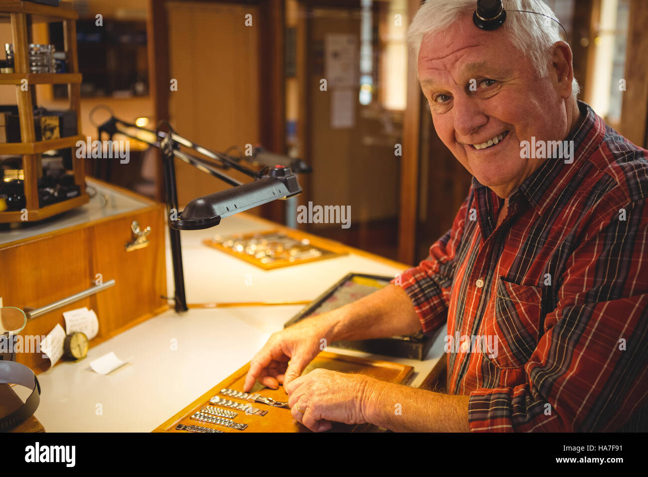 Horologist working in workshop Stock Photo - Alamy