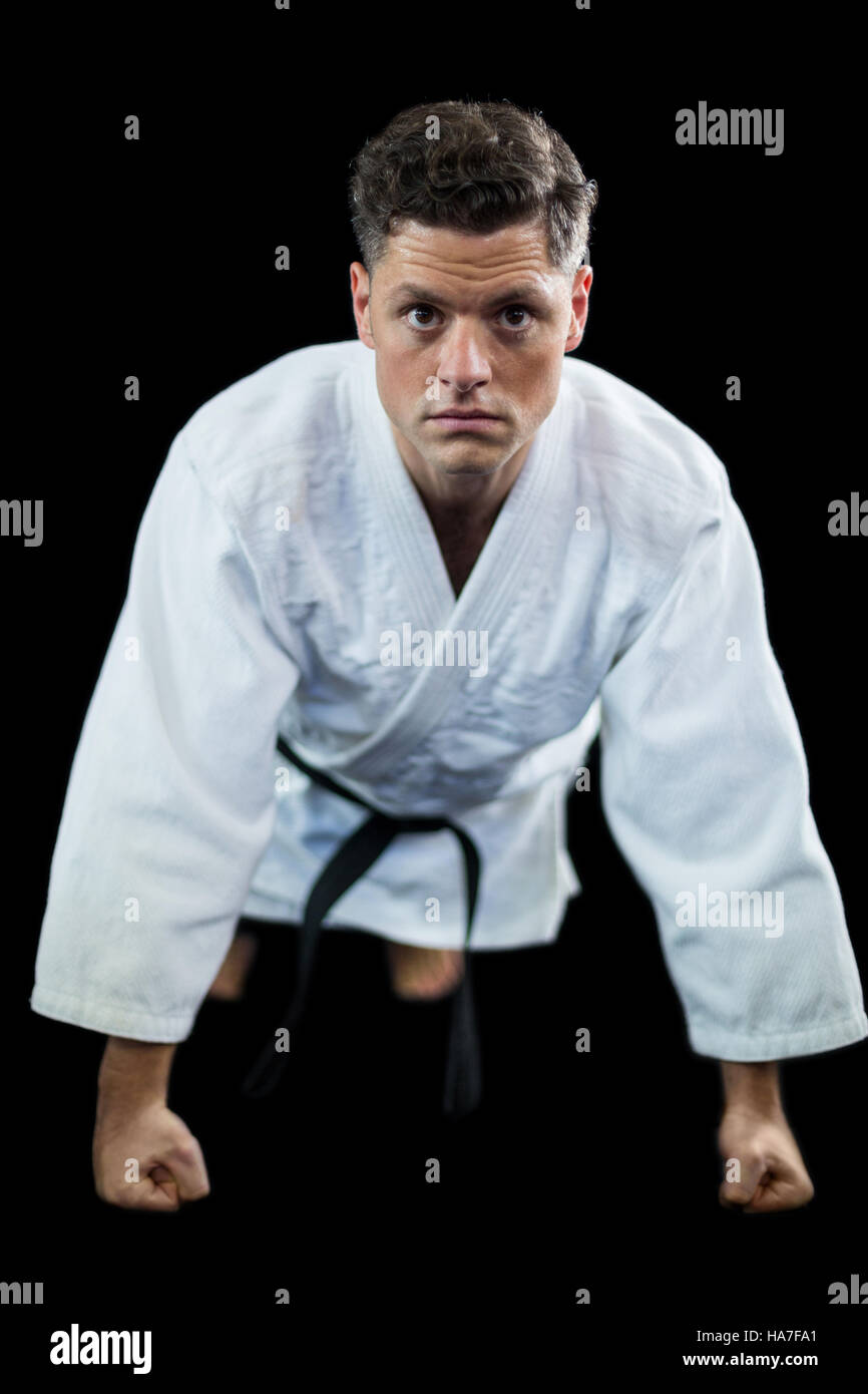 Karate player doing push-up Stock Photo - Alamy
