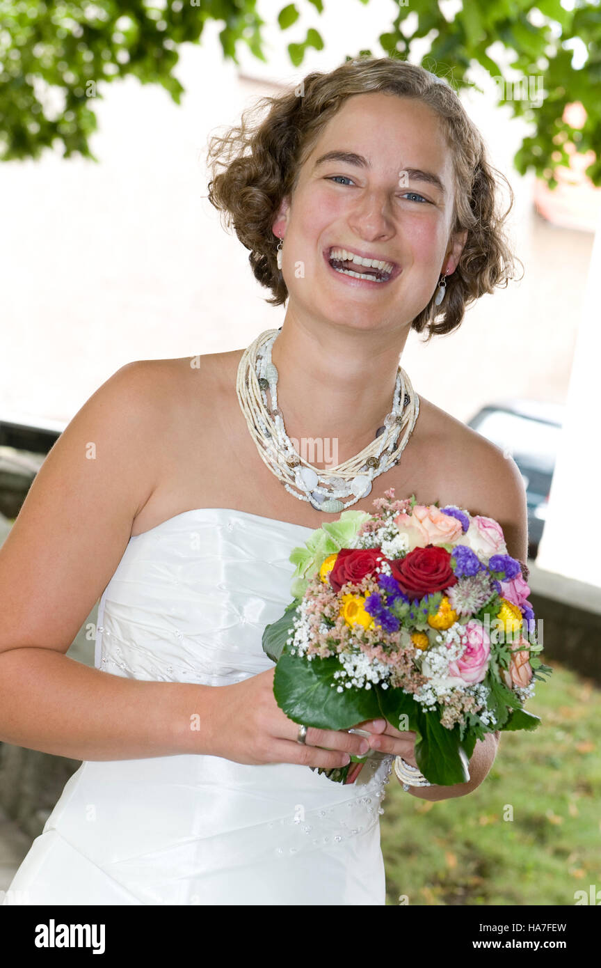 Bride Holding Bouquet Of Flowers