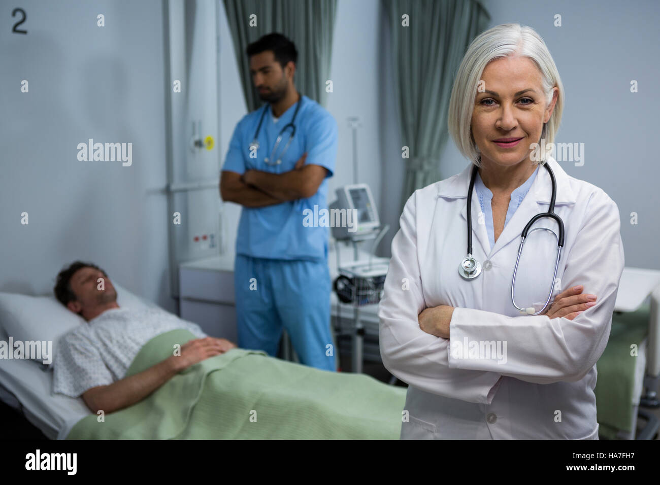 Portrait of doctor standing in ward Stock Photo - Alamy