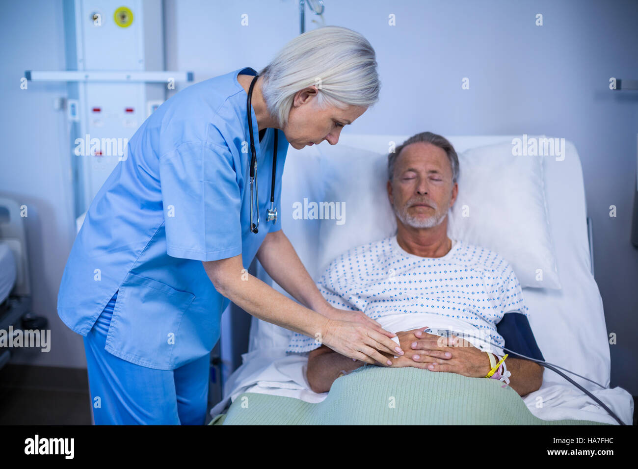 Nurse examining a patient Stock Photo - Alamy
