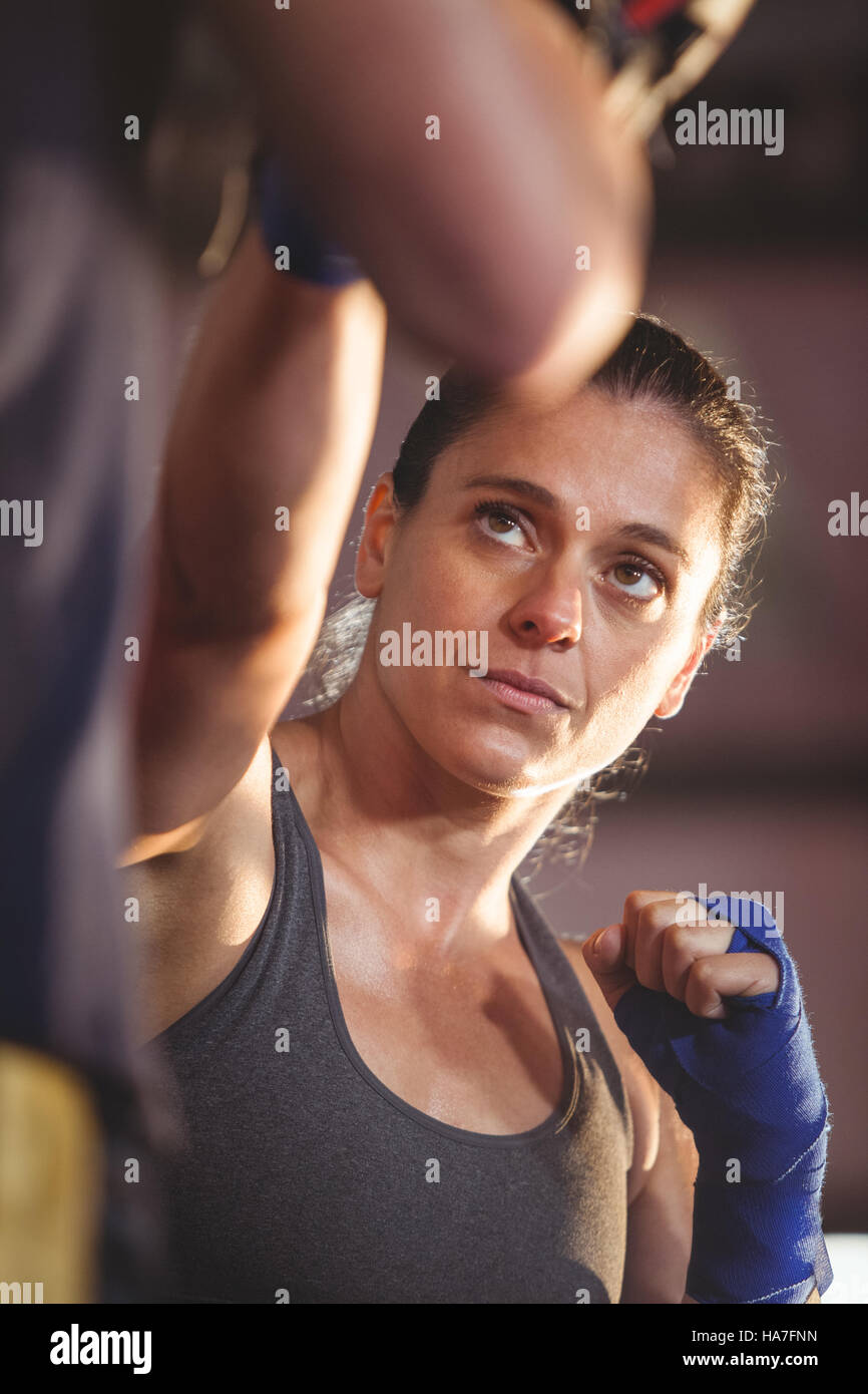 Female boxer practicing in the ring Stock Photo - Alamy