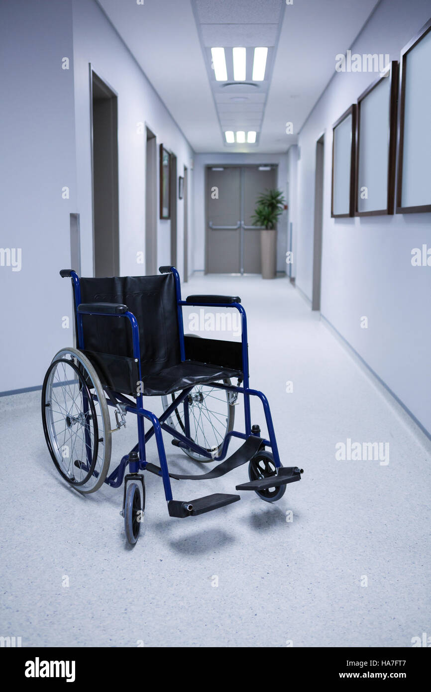 Empty wheelchair in corridor Stock Photo - Alamy