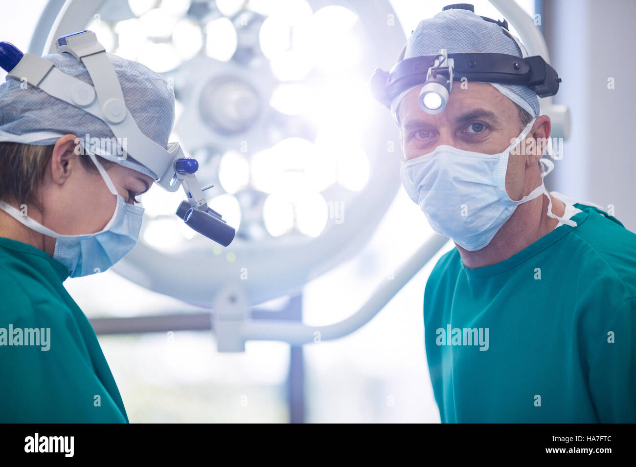 Surgeons performing operation in operation room Stock Photo - Alamy