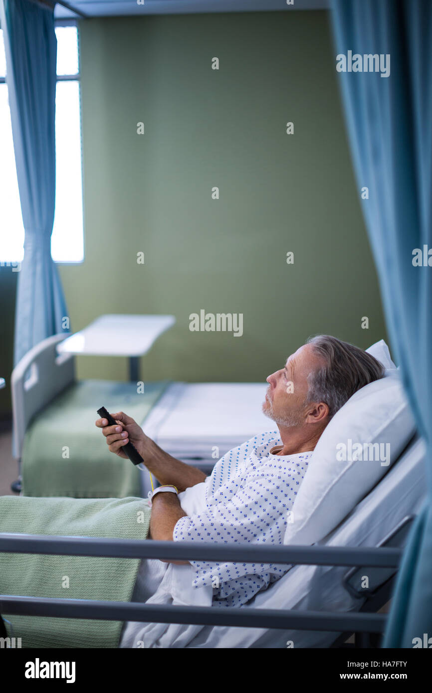 Sick man watching tv hi-res stock photography and images - Alamy