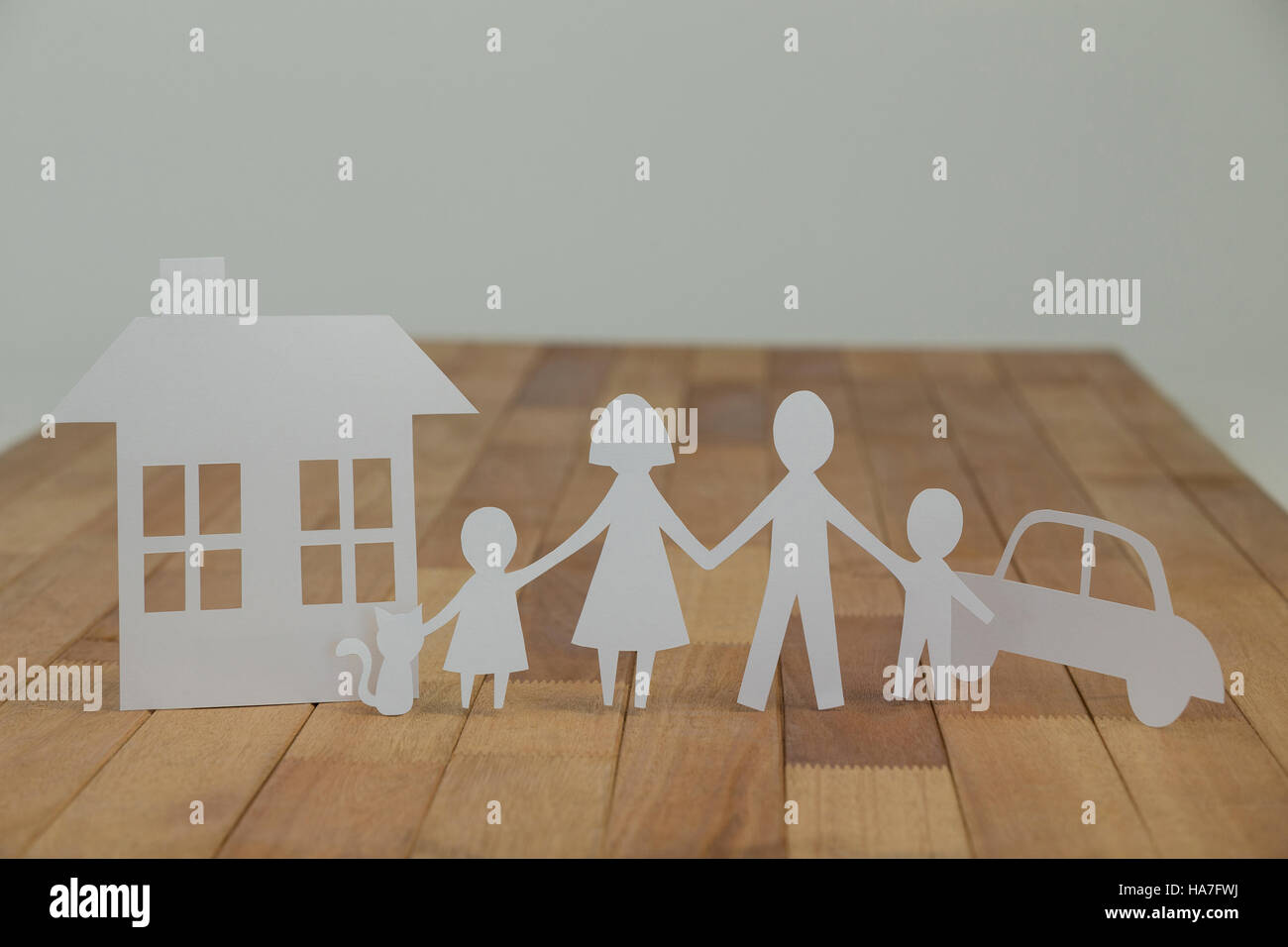 Paper cutout family with house and car Stock Photo - Alamy