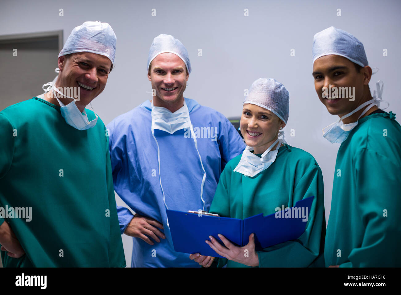 Portrait of surgeons team standing in corridor Stock Photo - Alamy