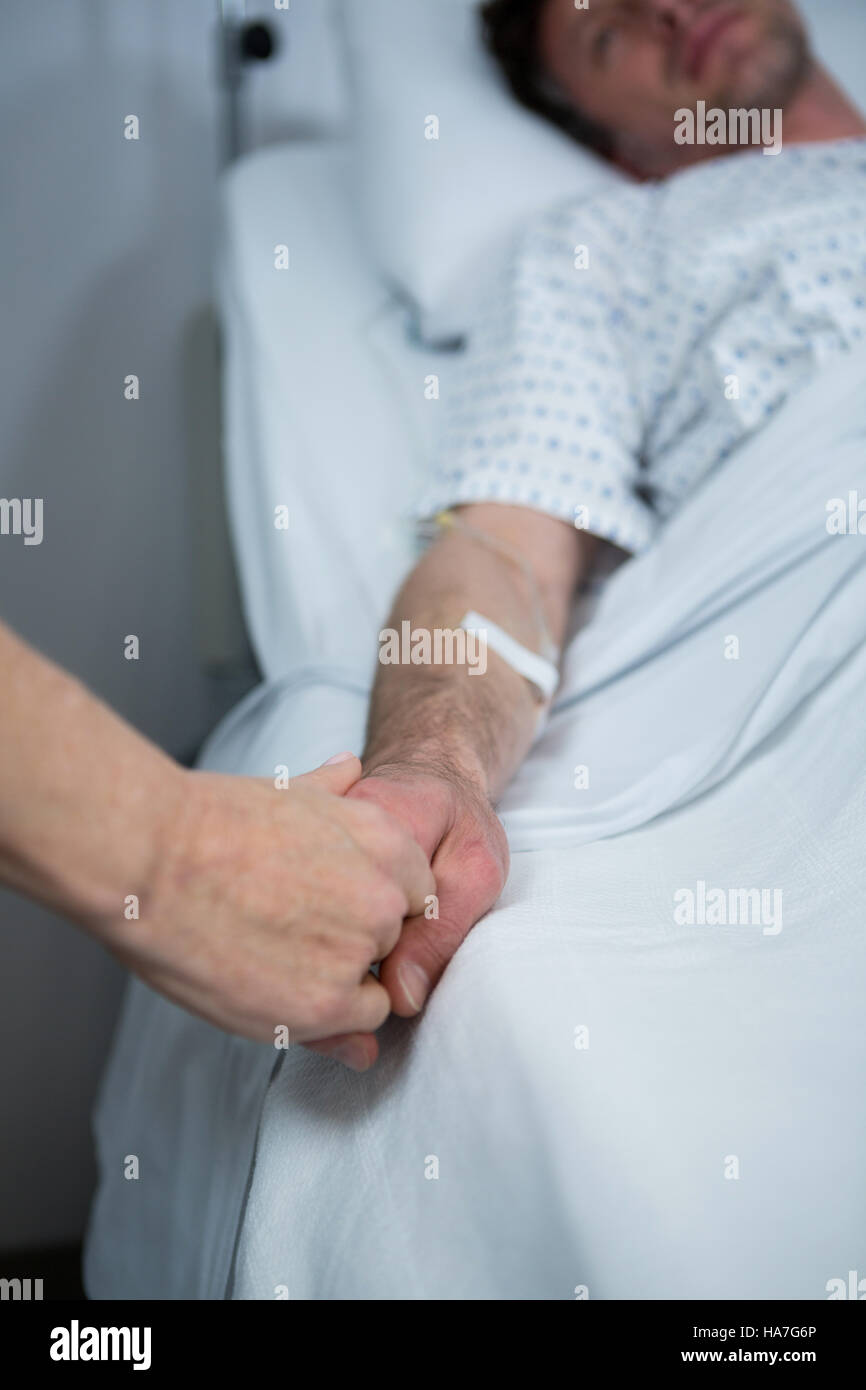 Doctor consoling a patient Stock Photo - Alamy