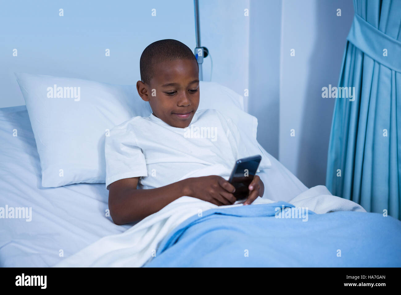 Patient using mobile phone in ward Stock Photo - Alamy