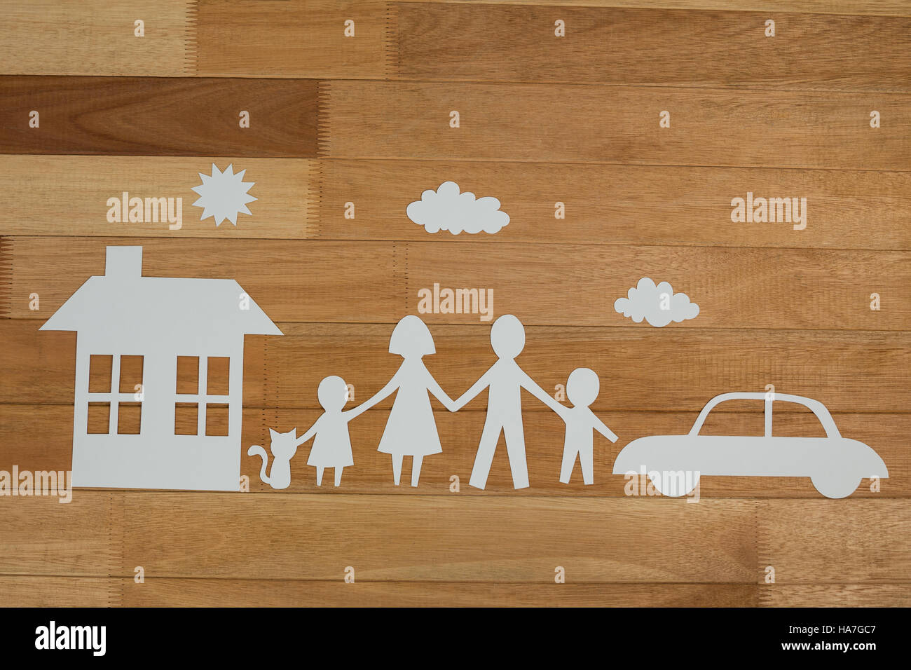 Paper cutout family with house and car Stock Photo - Alamy