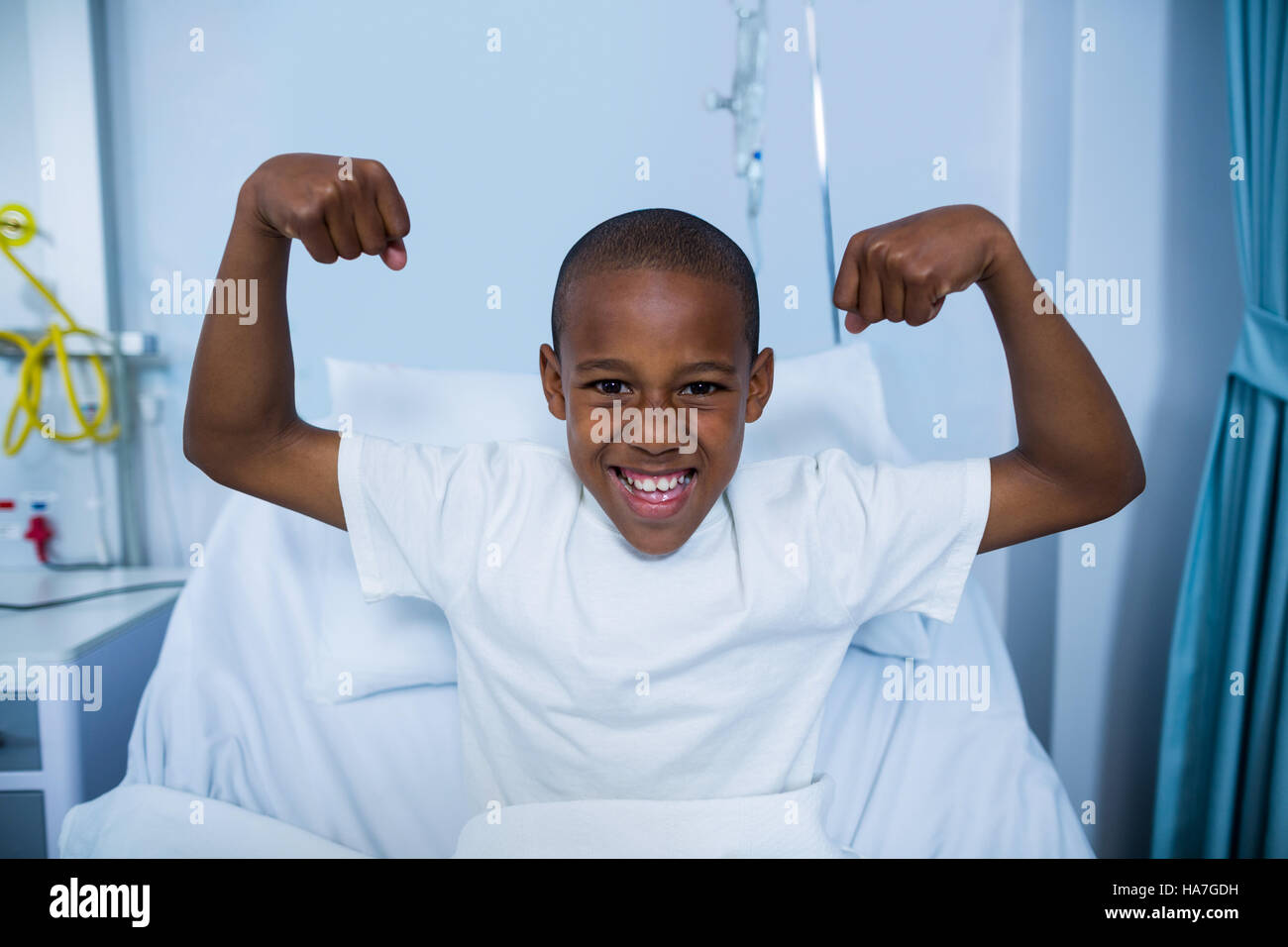 Portrait of patient showing muscle Stock Photo - Alamy