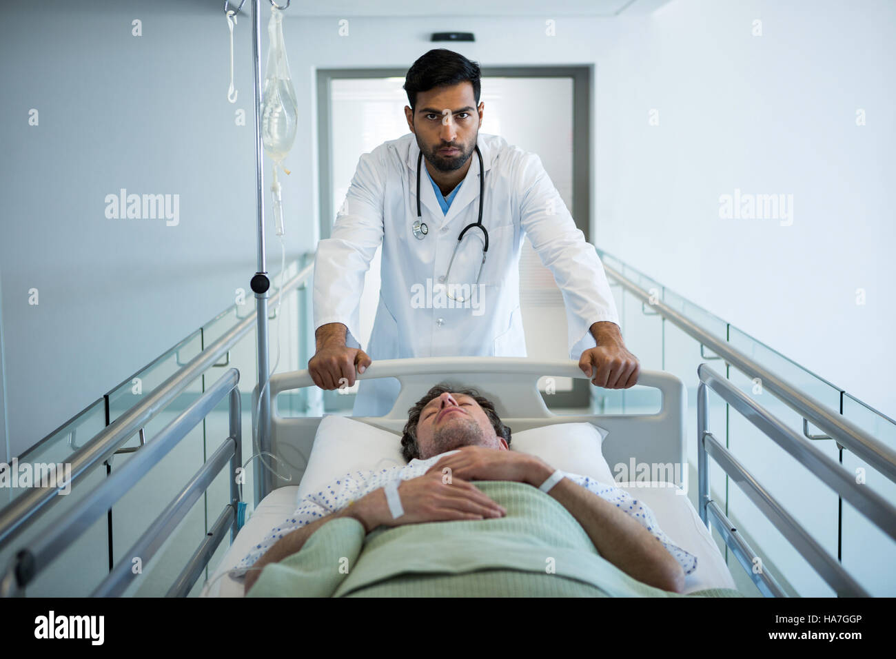 Doctor pushing emergency stretcher bed in corridor Stock Photo - Alamy