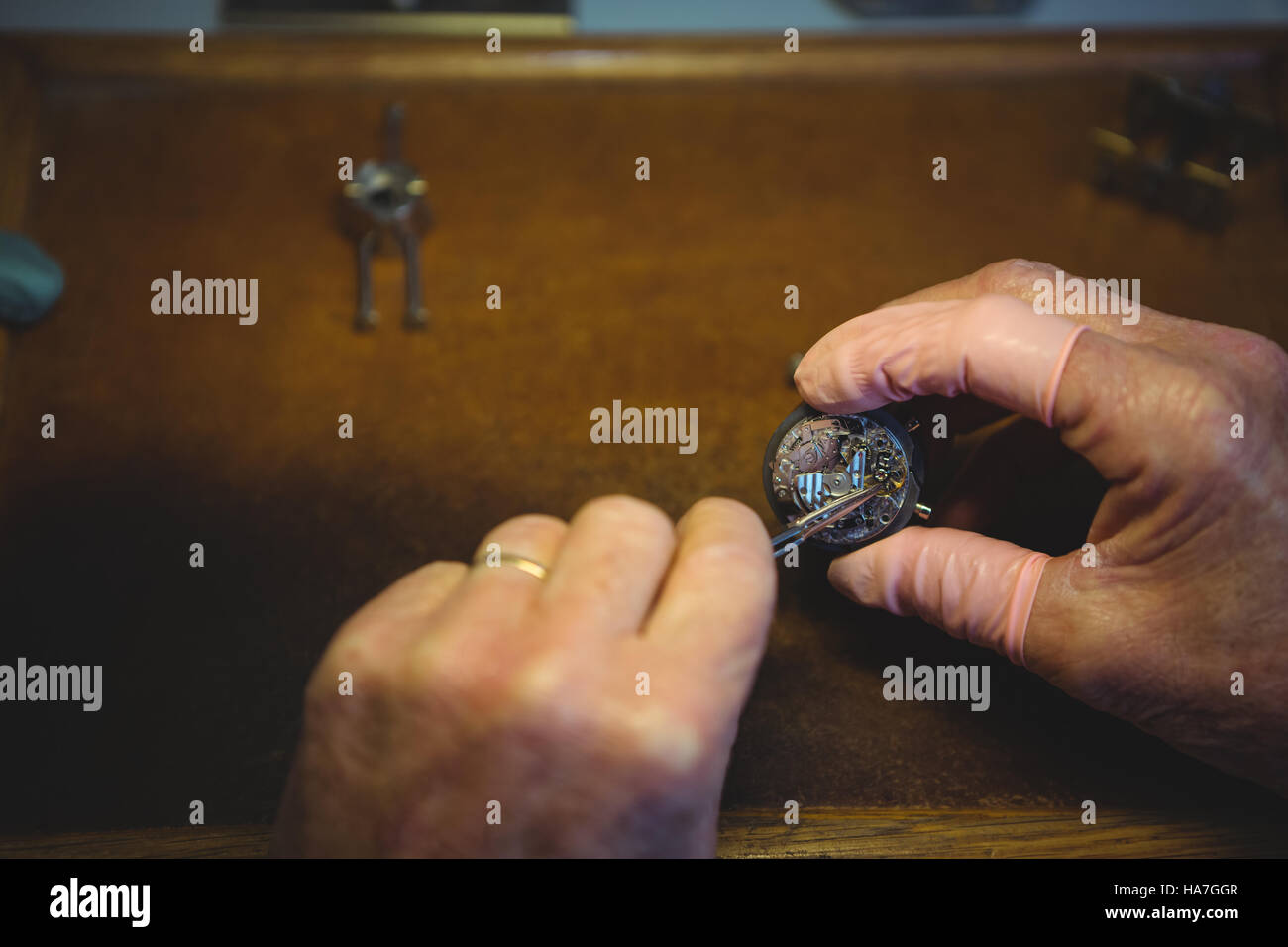 Horologist repairing a watch Stock Photo - Alamy
