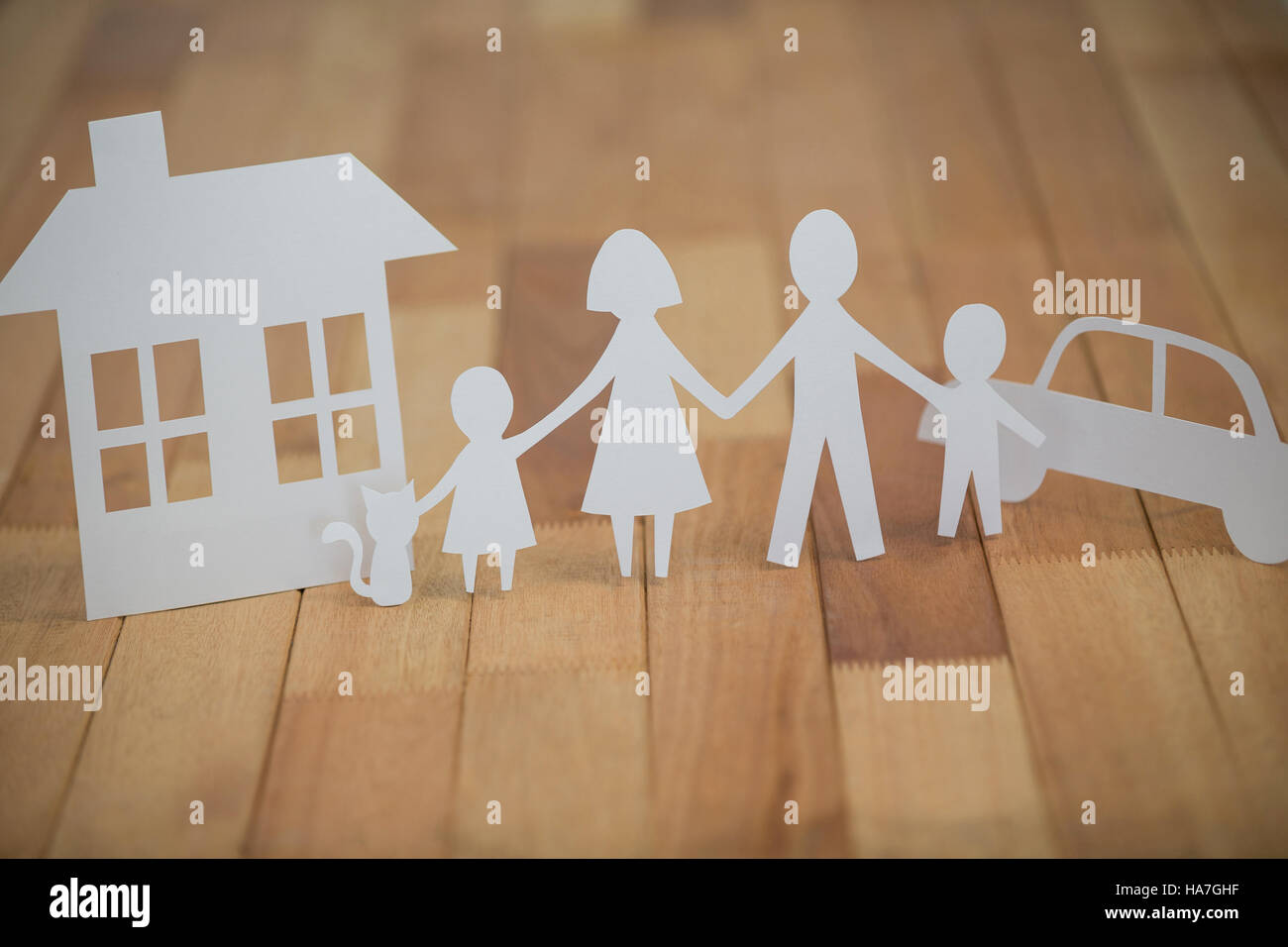 Paper cutout family with house and car Stock Photo - Alamy