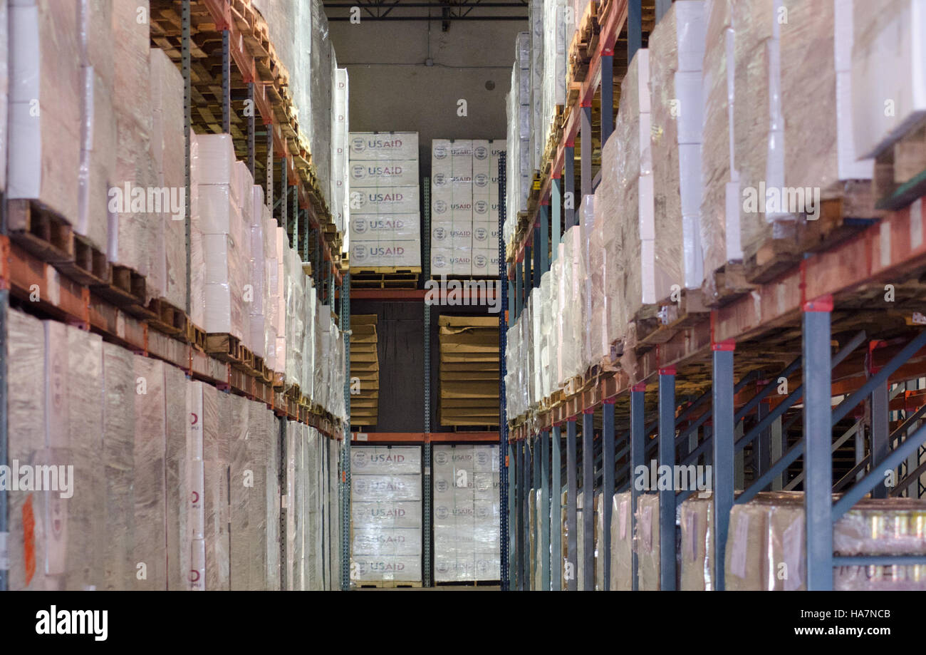 A forklift unloads pallets of aid at the USDA warehouse in Miami as ...