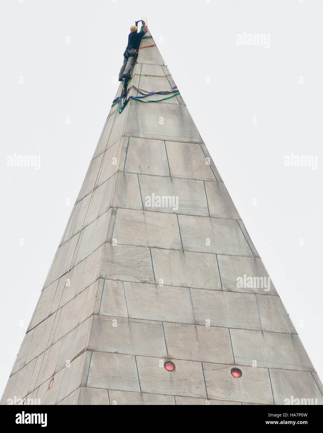 A climber conducts an inspection on the Washington Monument following ...