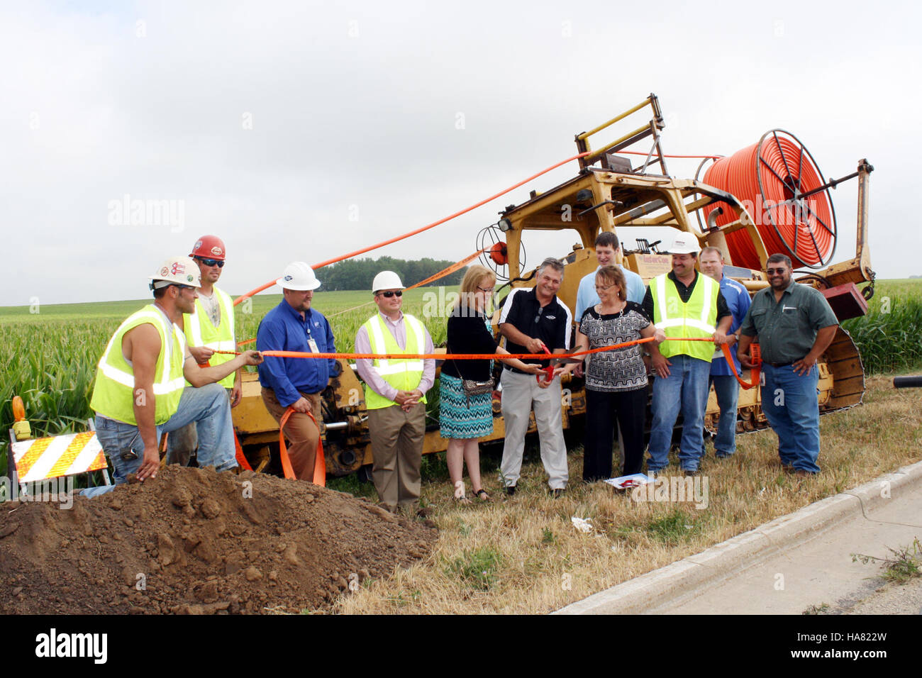 This image captures a ribbon-cutting ceremony, symbolizing the opening ...