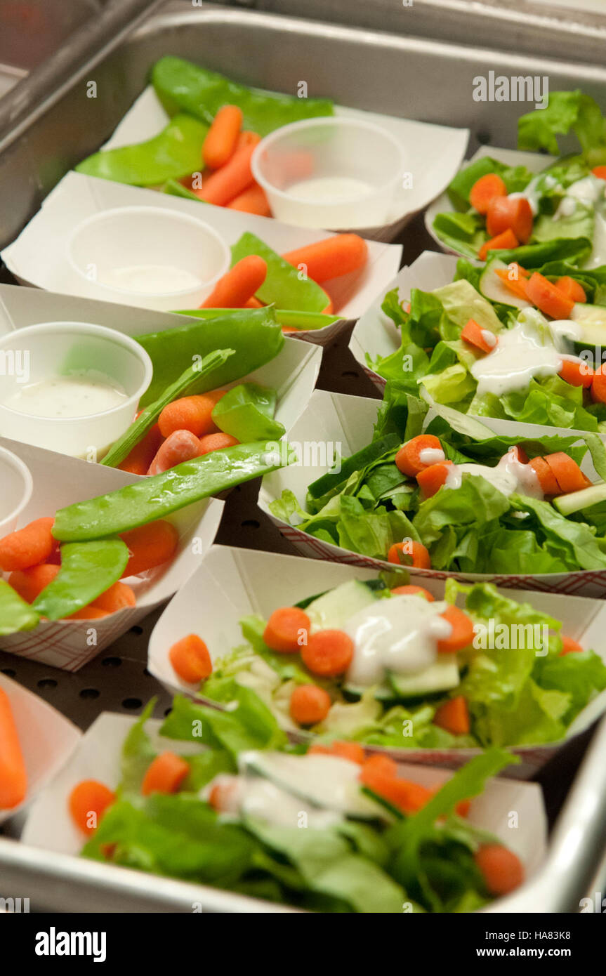 Teachers serve healthy school lunches including fruits, vegetables, and ...