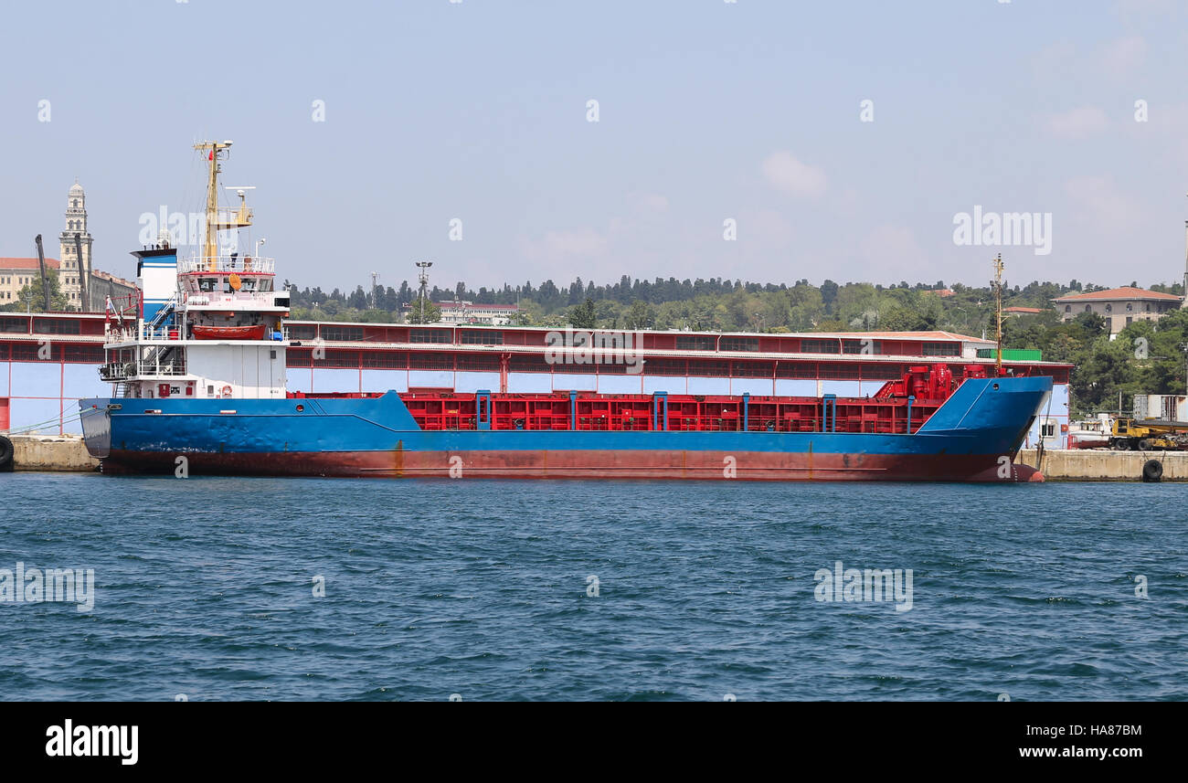 Cargo ship loading in a trading port Stock Photo - Alamy