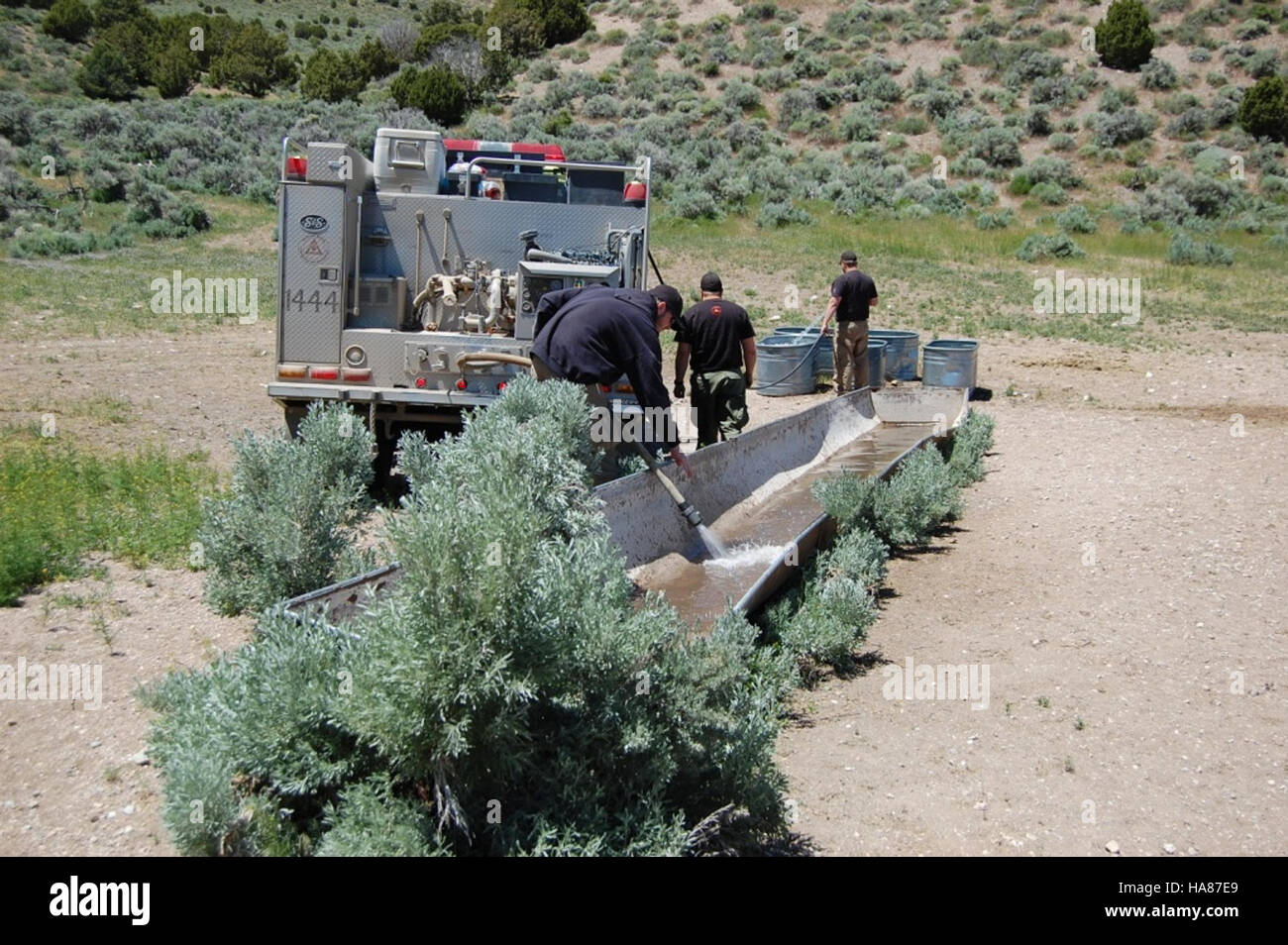 A Bureau of Land Management (BLM) fire engine is seen hauling water to ...
