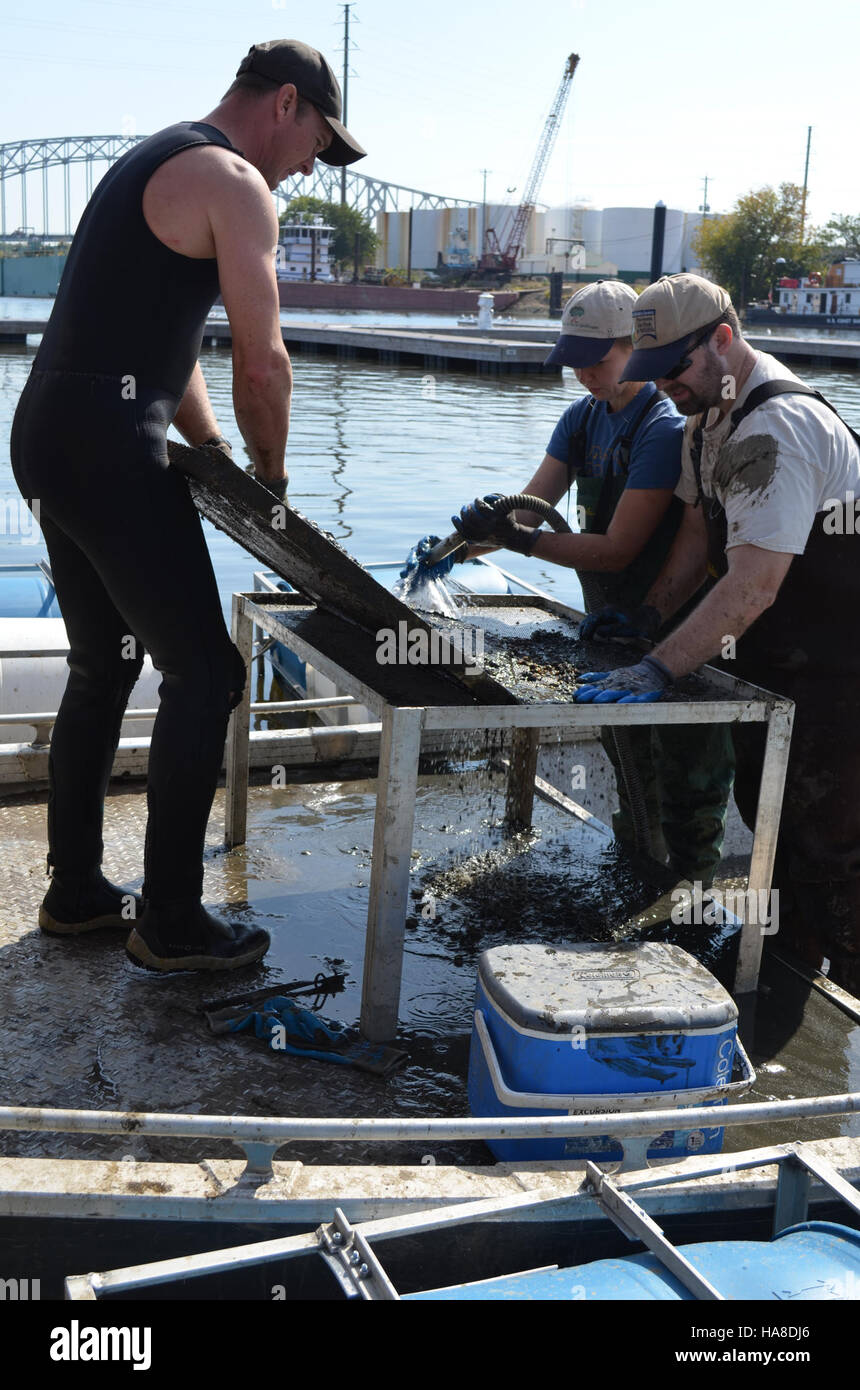 The image depicts a routine cage cleaning process in a National Park ...