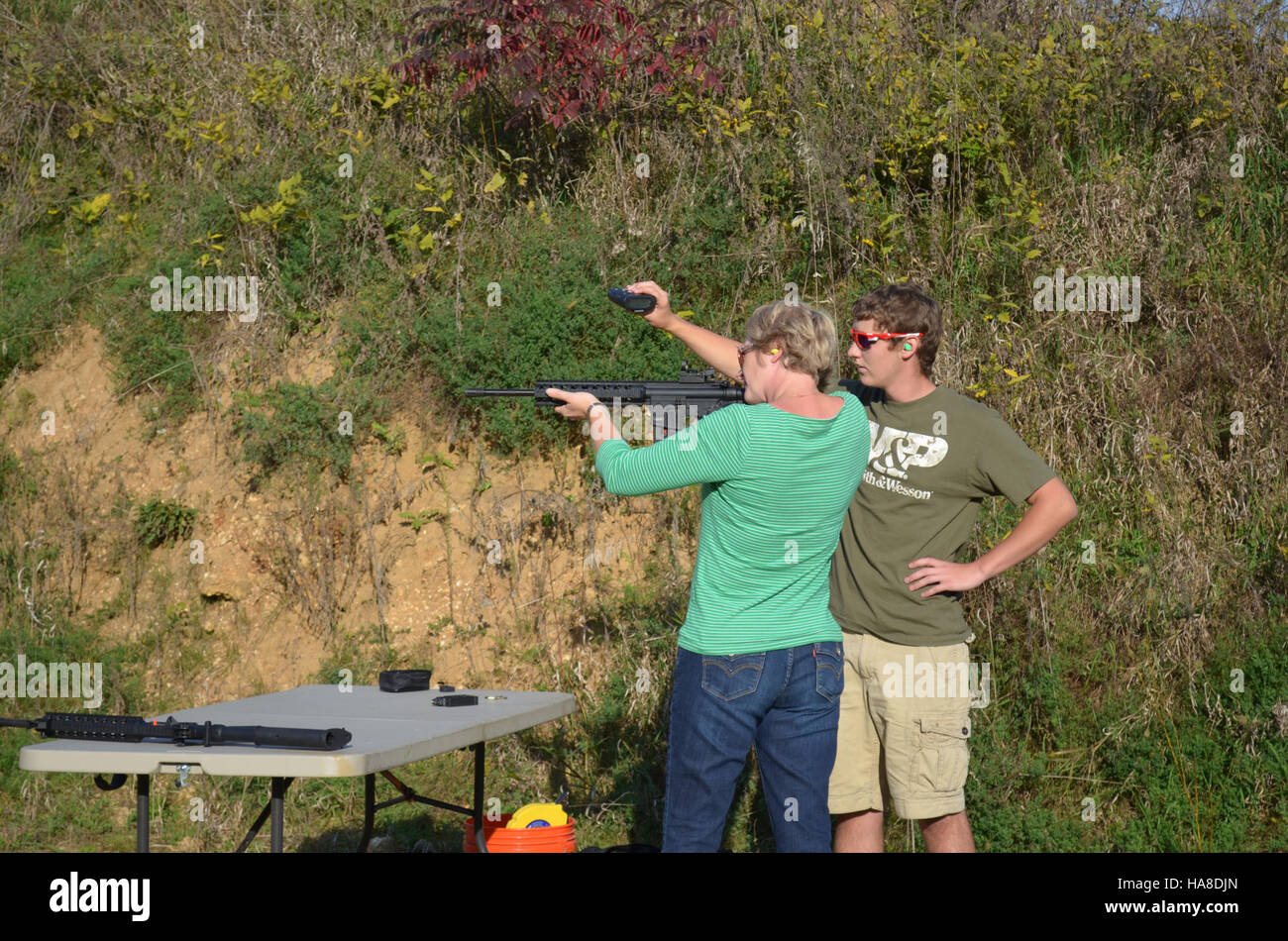A photo captures a visitor aiming a rifle during a controlled ...