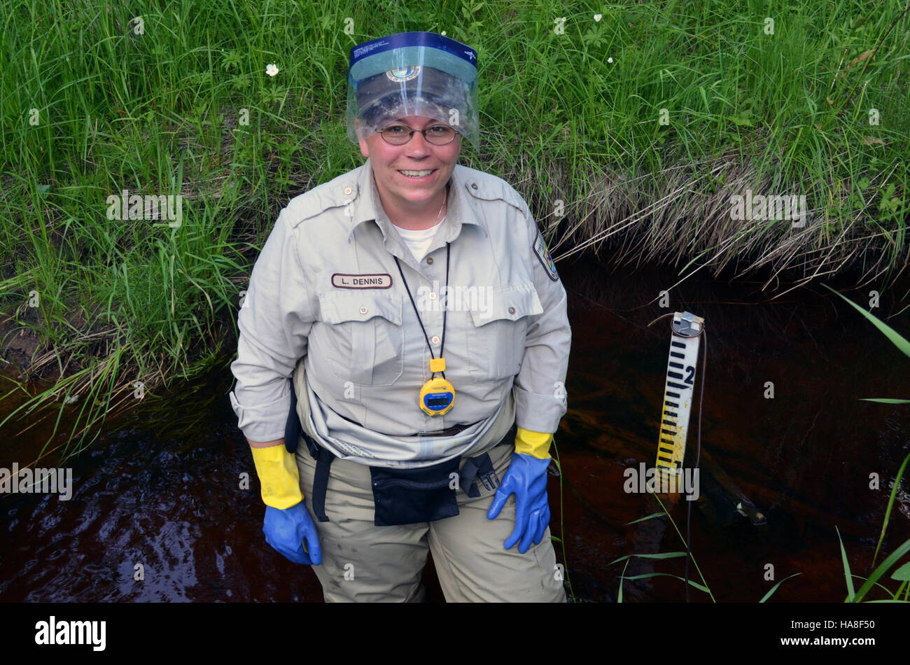 Lisa Dennis, a biologist with the U.S. Fish and Wildlife Service, is ...