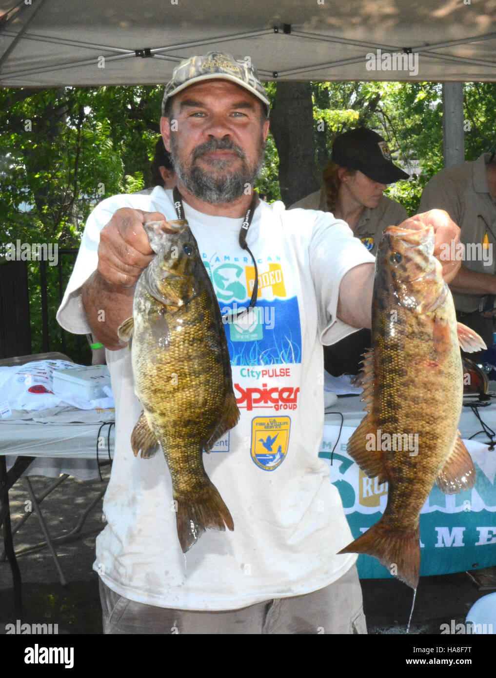 The image shows a fish rodeo, a competitive event involving catching ...