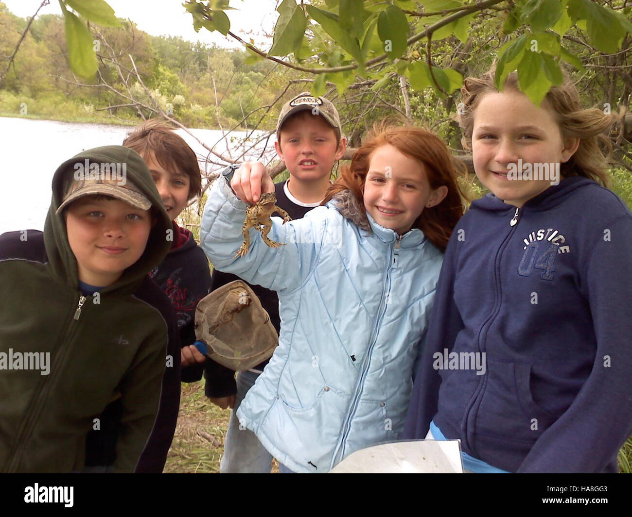 This image shows efforts to locate and protect frog species in a ...