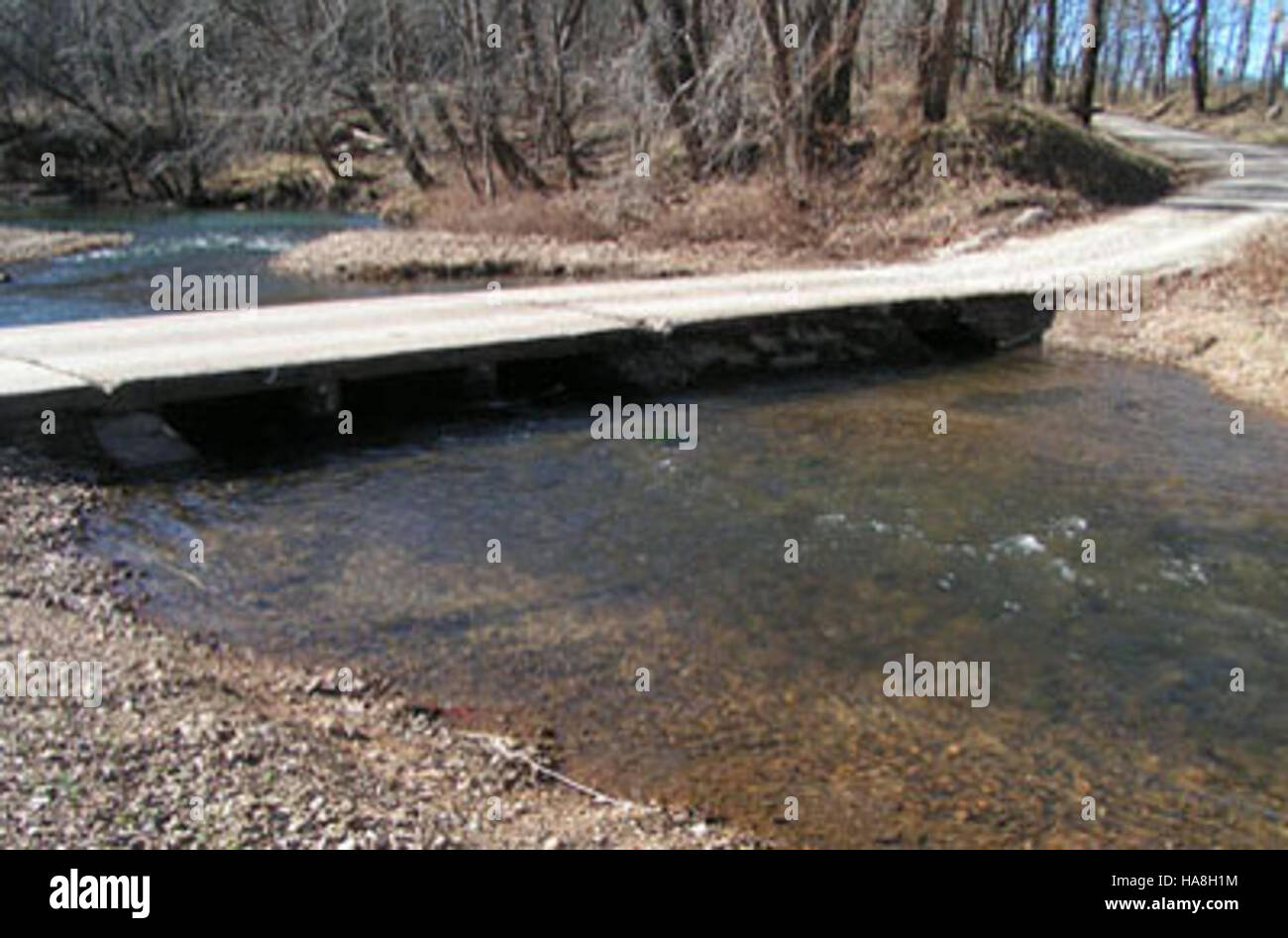 This image shows an old river crossing with limited fish passage ...
