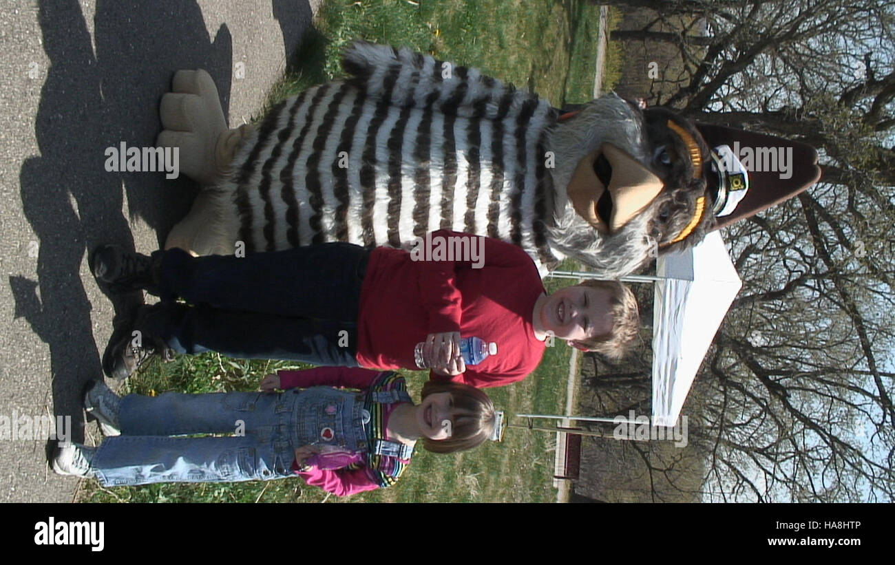 Children at a fair engage with a life-sized model of a prairie chicken ...