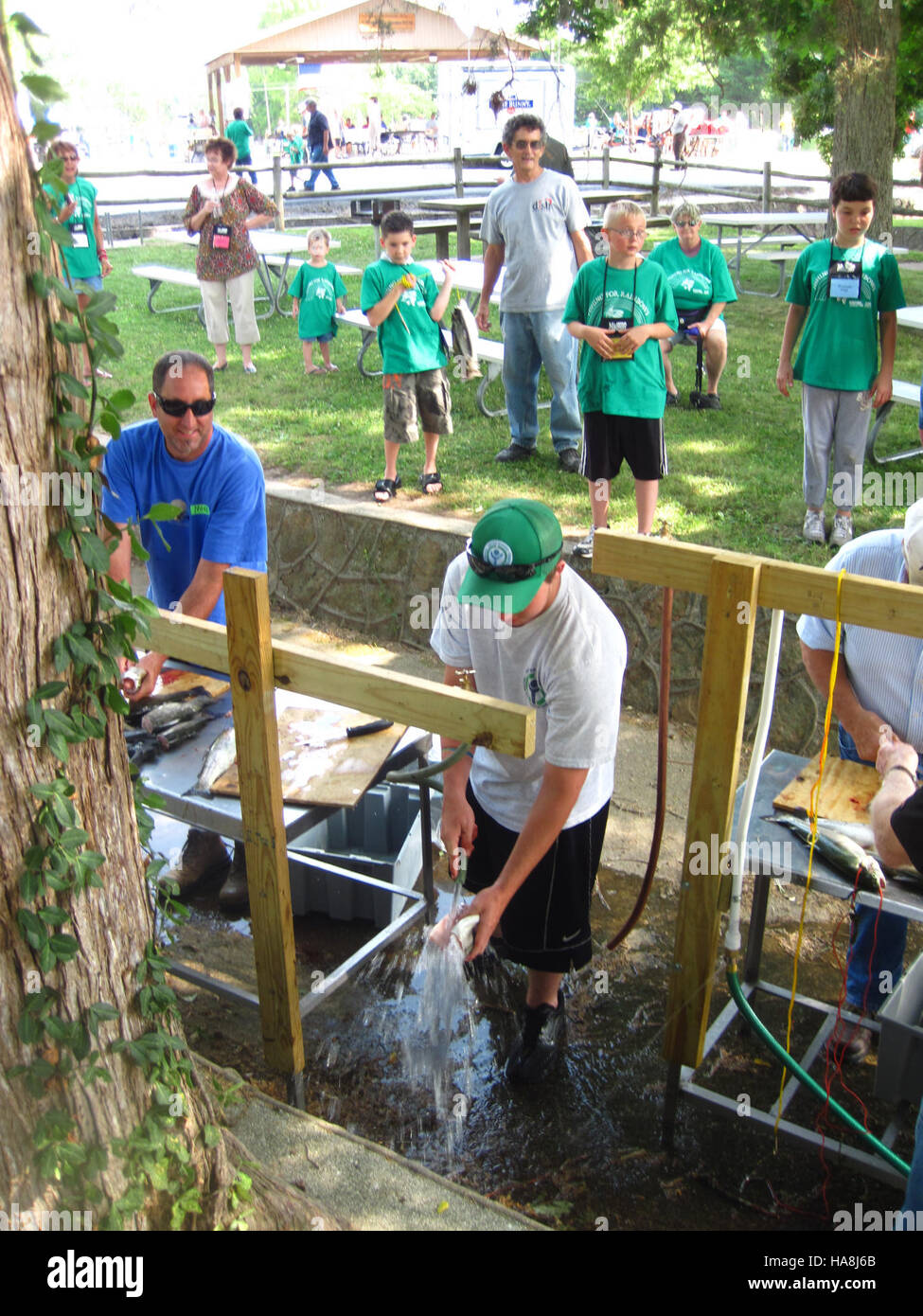 Children wash fish as part of a nature education program in a national ...