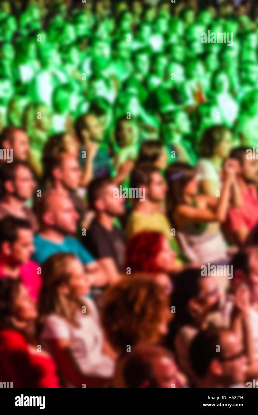 Blurred Image of People at Music Concert, in green and red lights ...