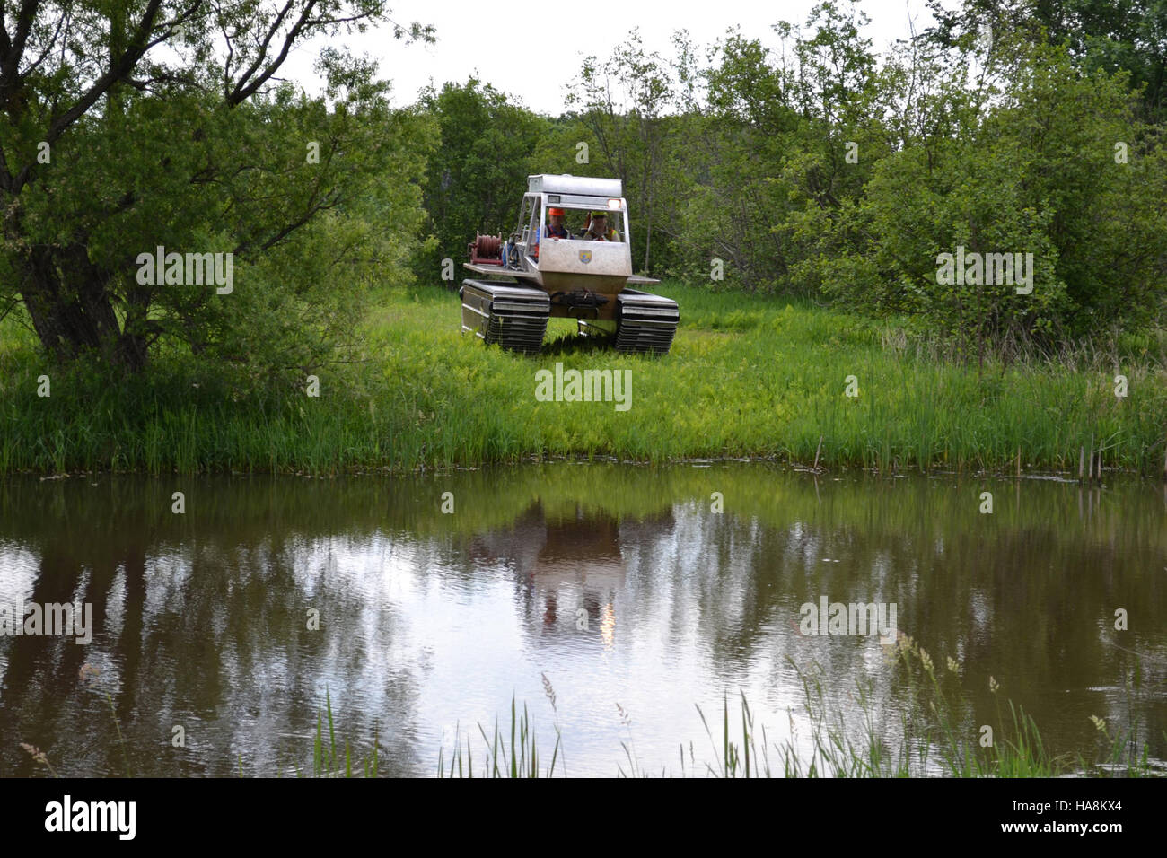 This image shows a Marsh Master vehicle approaching wetlands in a U.S ...