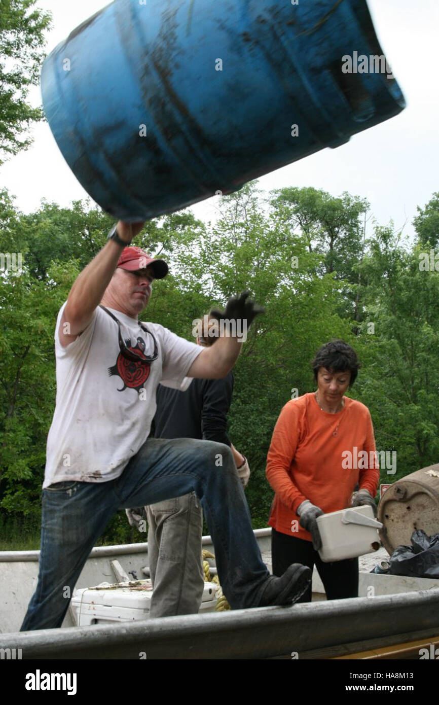 This image depicts a park ranger named Chad disposing of waste in a ...