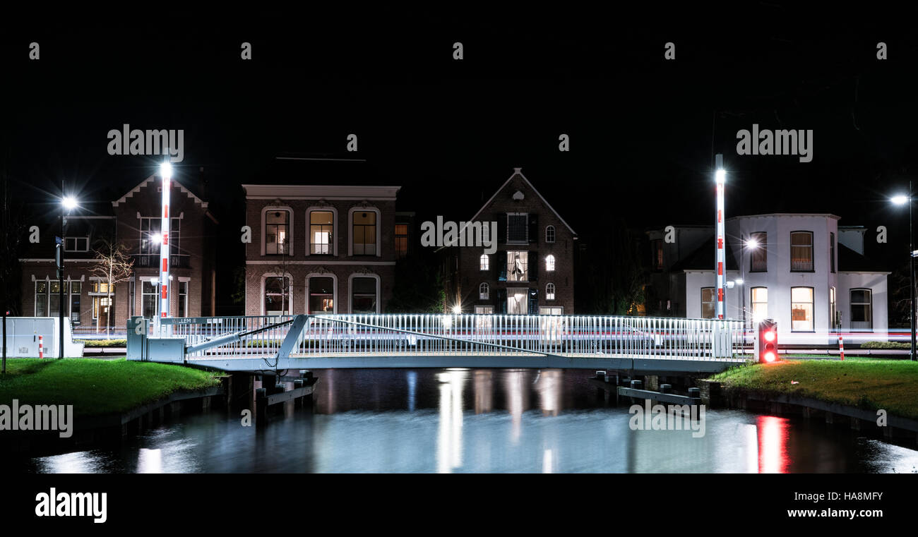 Dutch bicycle bridge at one of the canals in the Dutch town of Assen ...