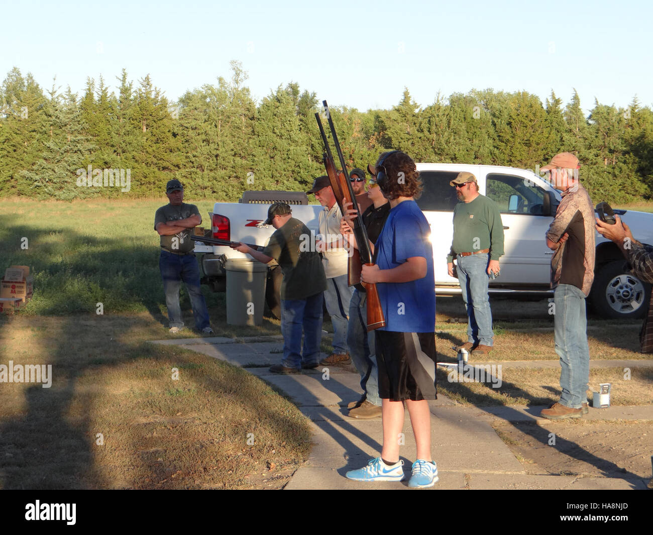 Trap shooting, a sport where participants aim at moving clay targets ...
