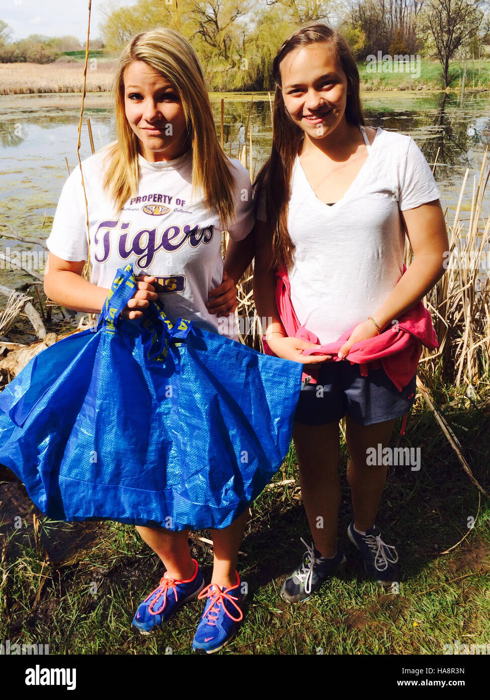 On Earth Day, young girls participate in environmental activities at a ...
