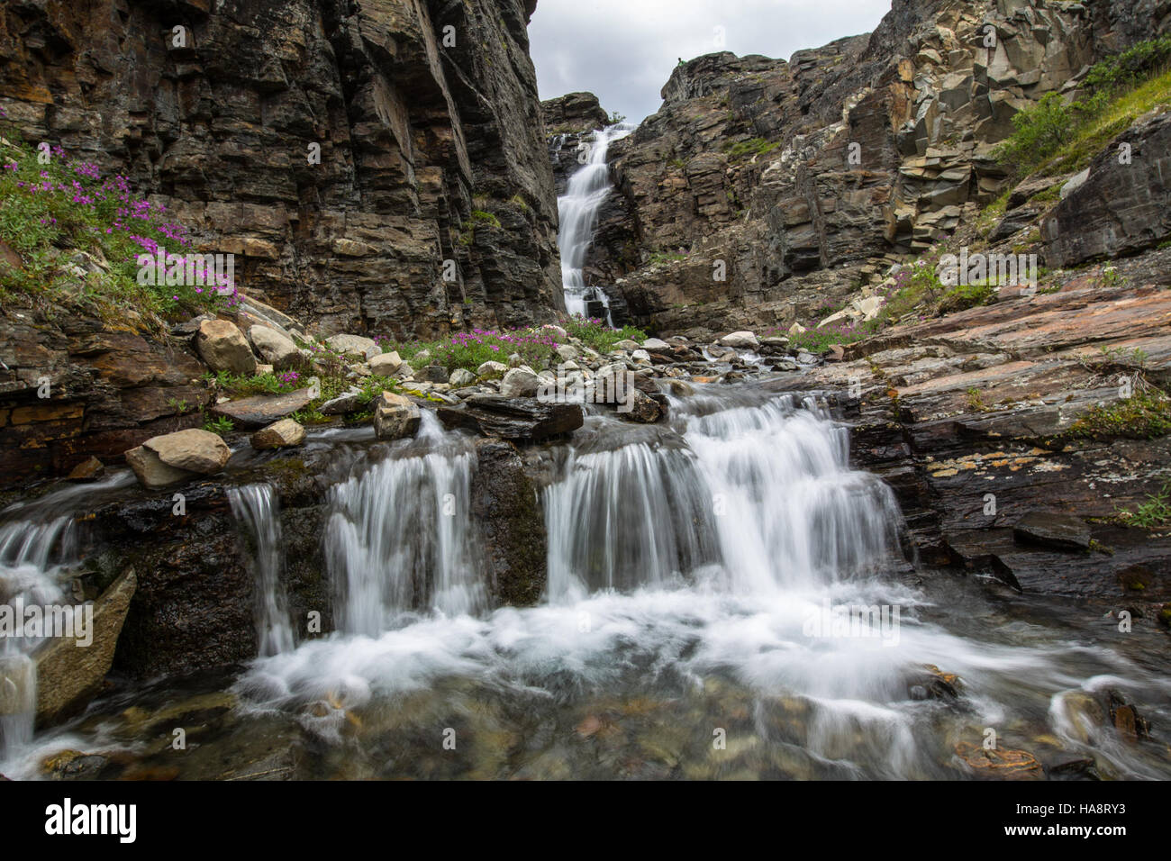 Waterfalls cascade along the Aqueduct in Alaska's national park system ...