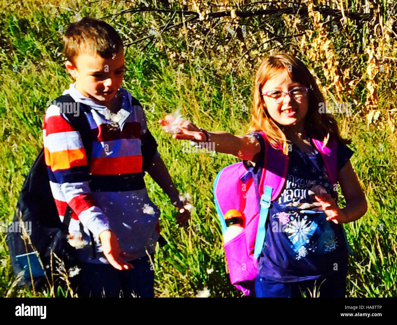 This image captures children interacting with nature at the Two Ponds ...