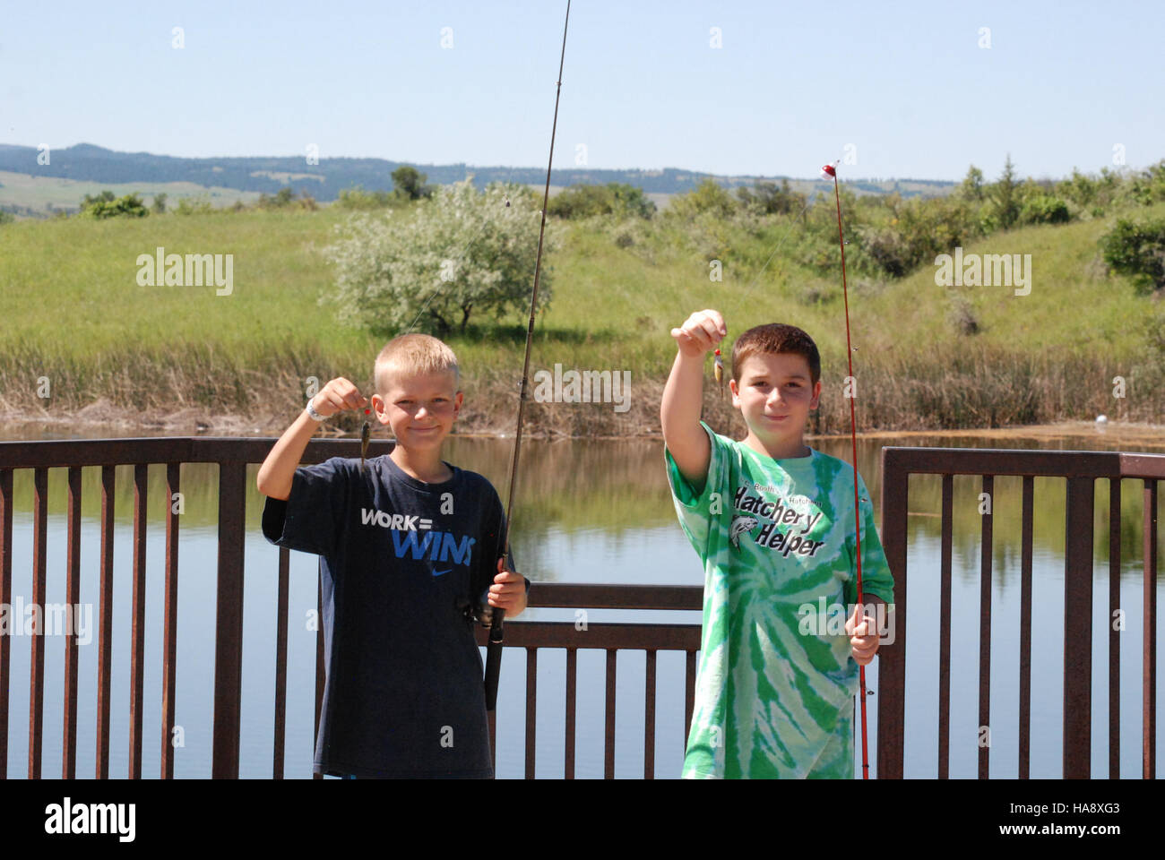 At D.C. Booth National Fish Hatchery, a hatchery worker displays their ...