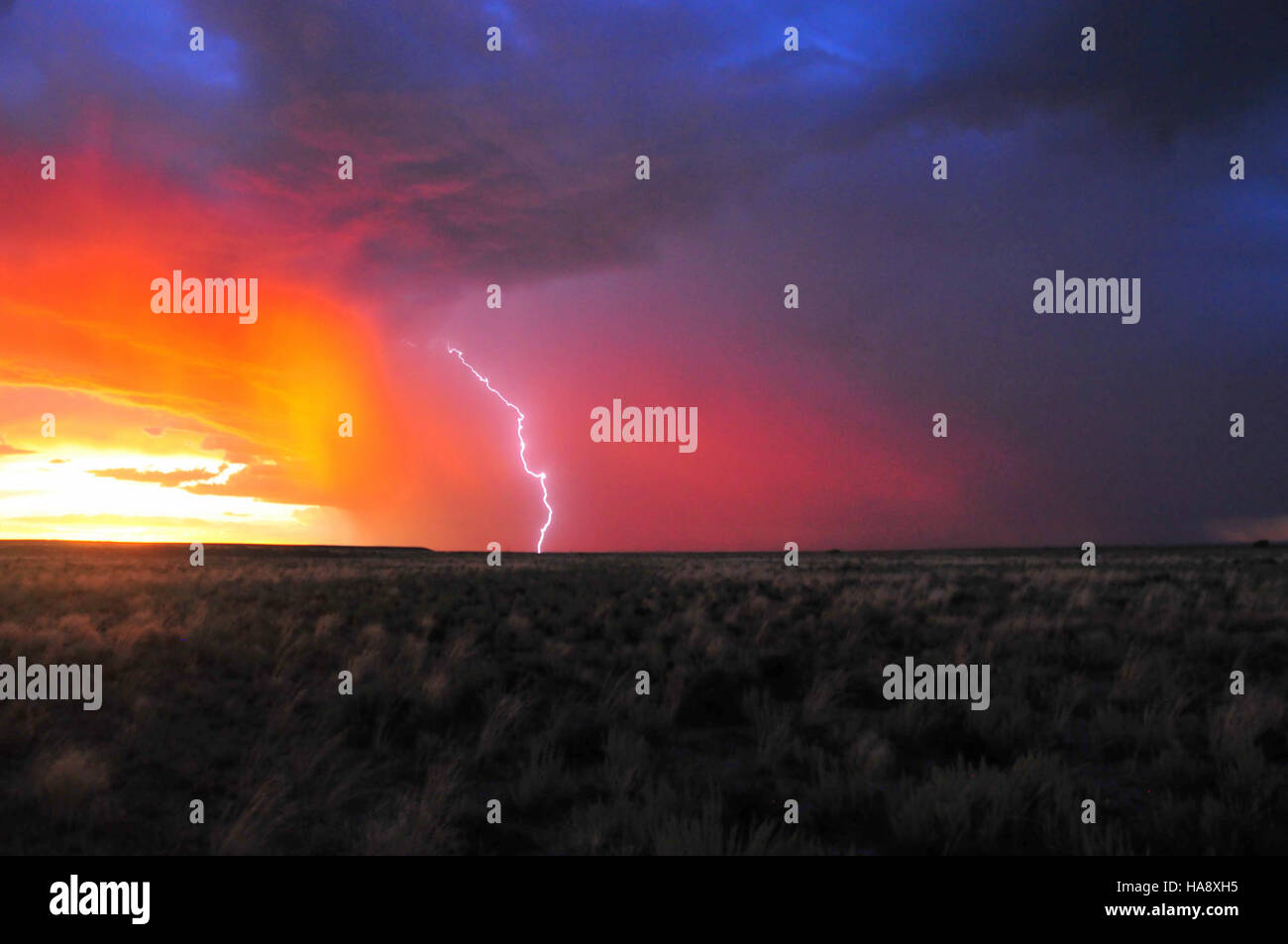 A dramatic sunset storm with lightning over Seedskadee National ...