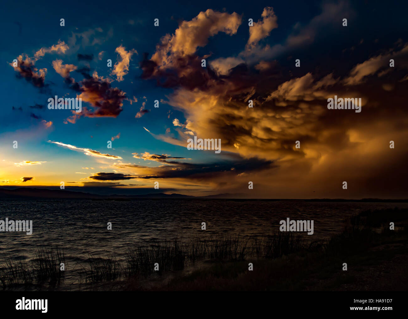 A dramatic sunset scene at a national park with storm clouds looming ...