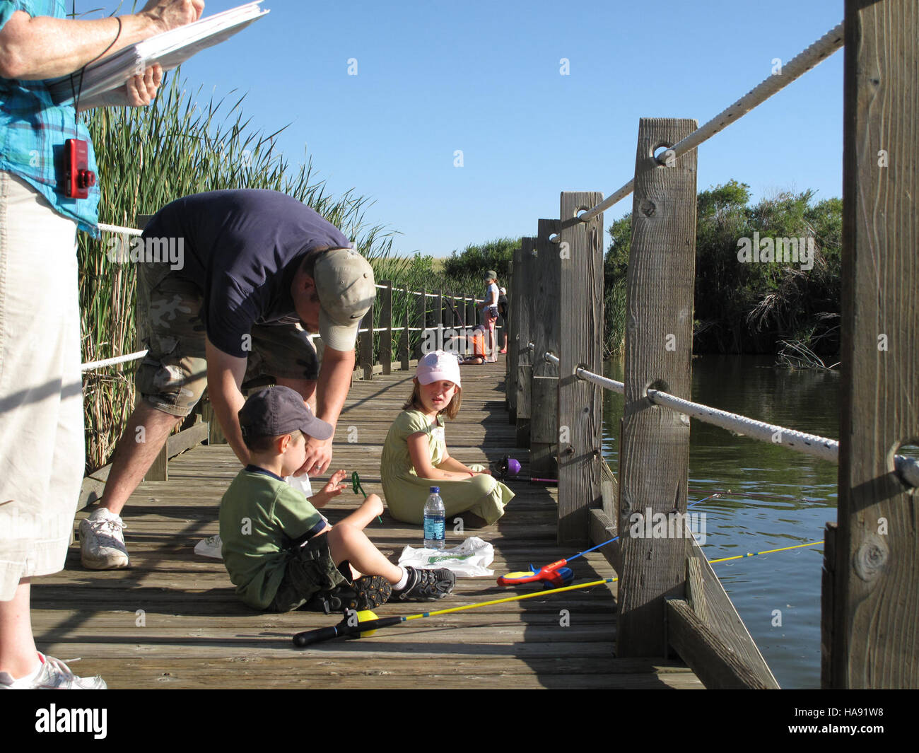 Visitors enjoy fishing in a national park, contributing to outdoor ...