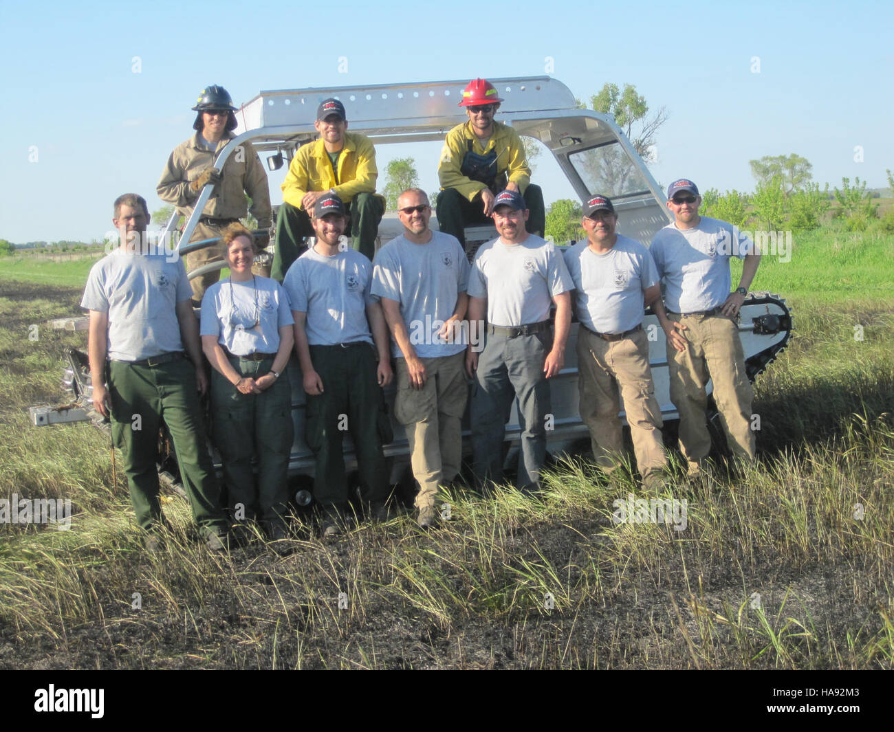 Fire staff members work in a National Park in the Mountain Prairie ...